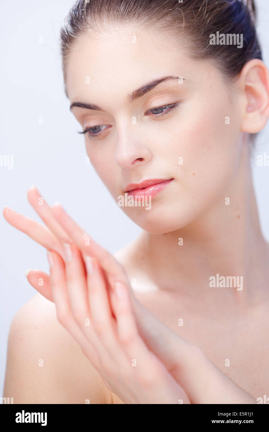 Woman giving herself a hand massage Stock Photo - Alamy