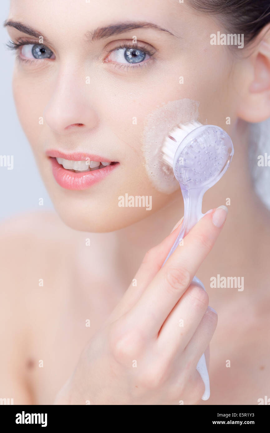 Woman using brush Stock Photo - Alamy