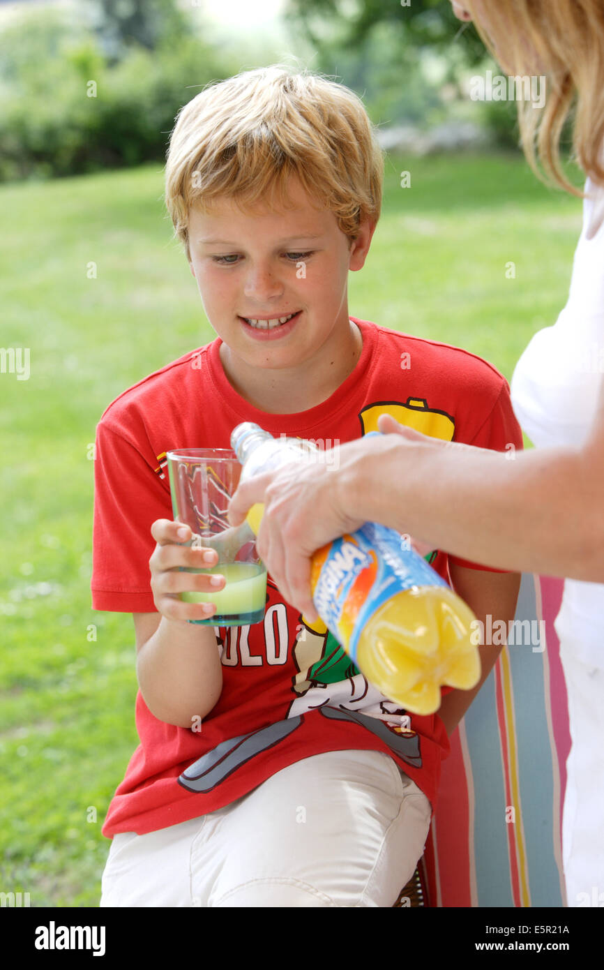 Boy drinking light sodas Stock Photo - Alamy
