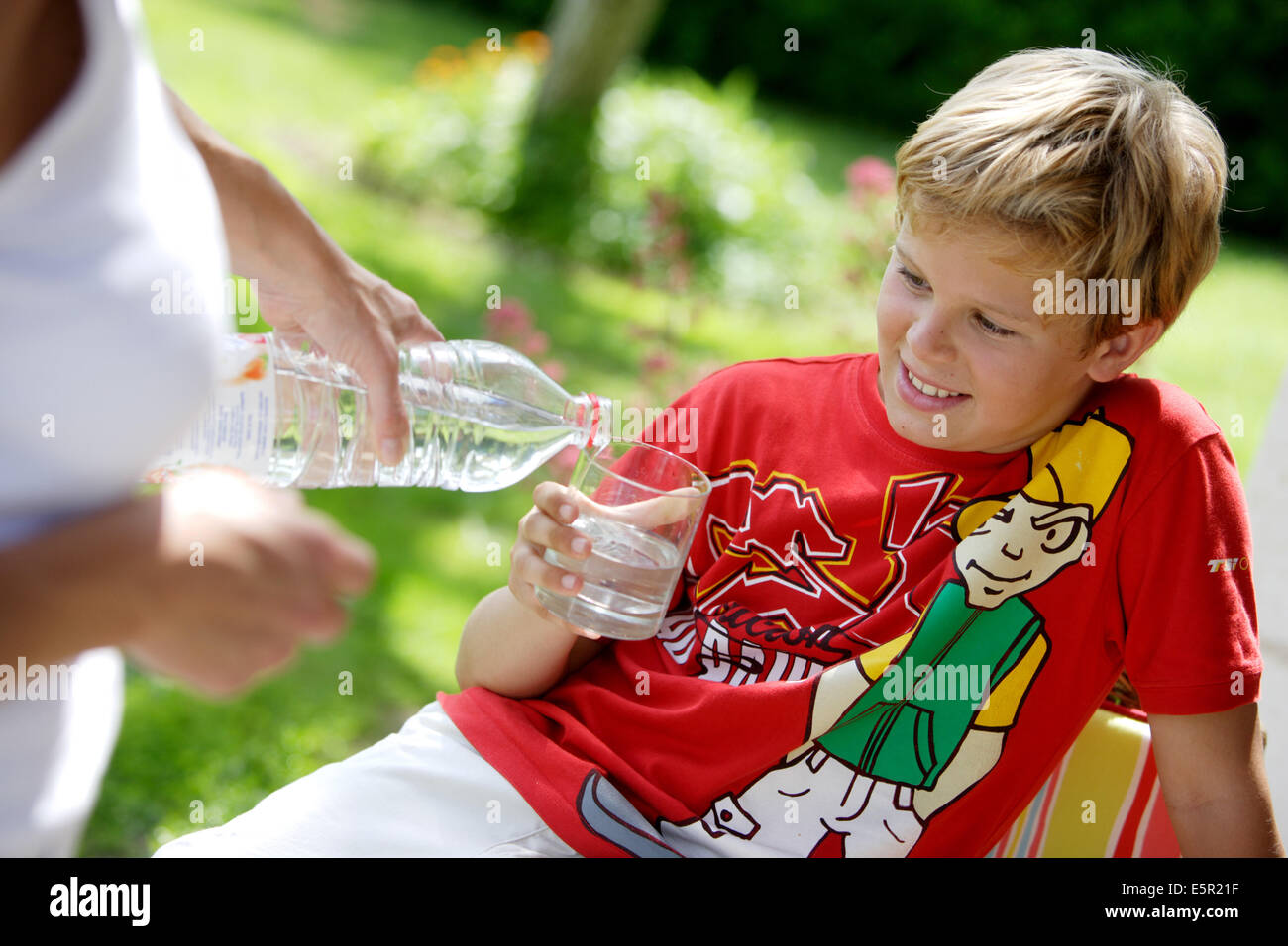 Boy drinking light drink Stock Photo - Alamy