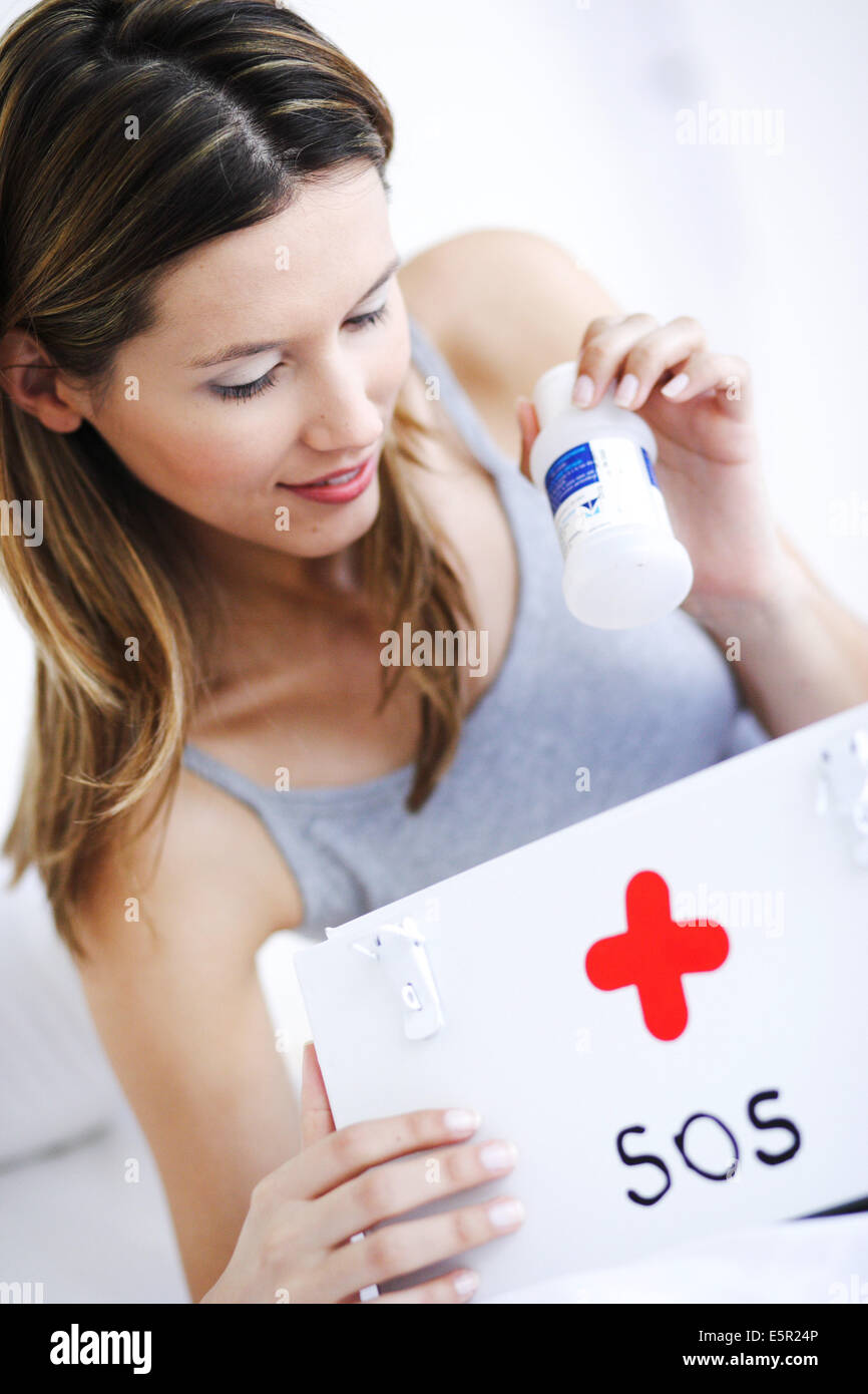 Woman first aid cabinet hi-res stock photography and images - Alamy