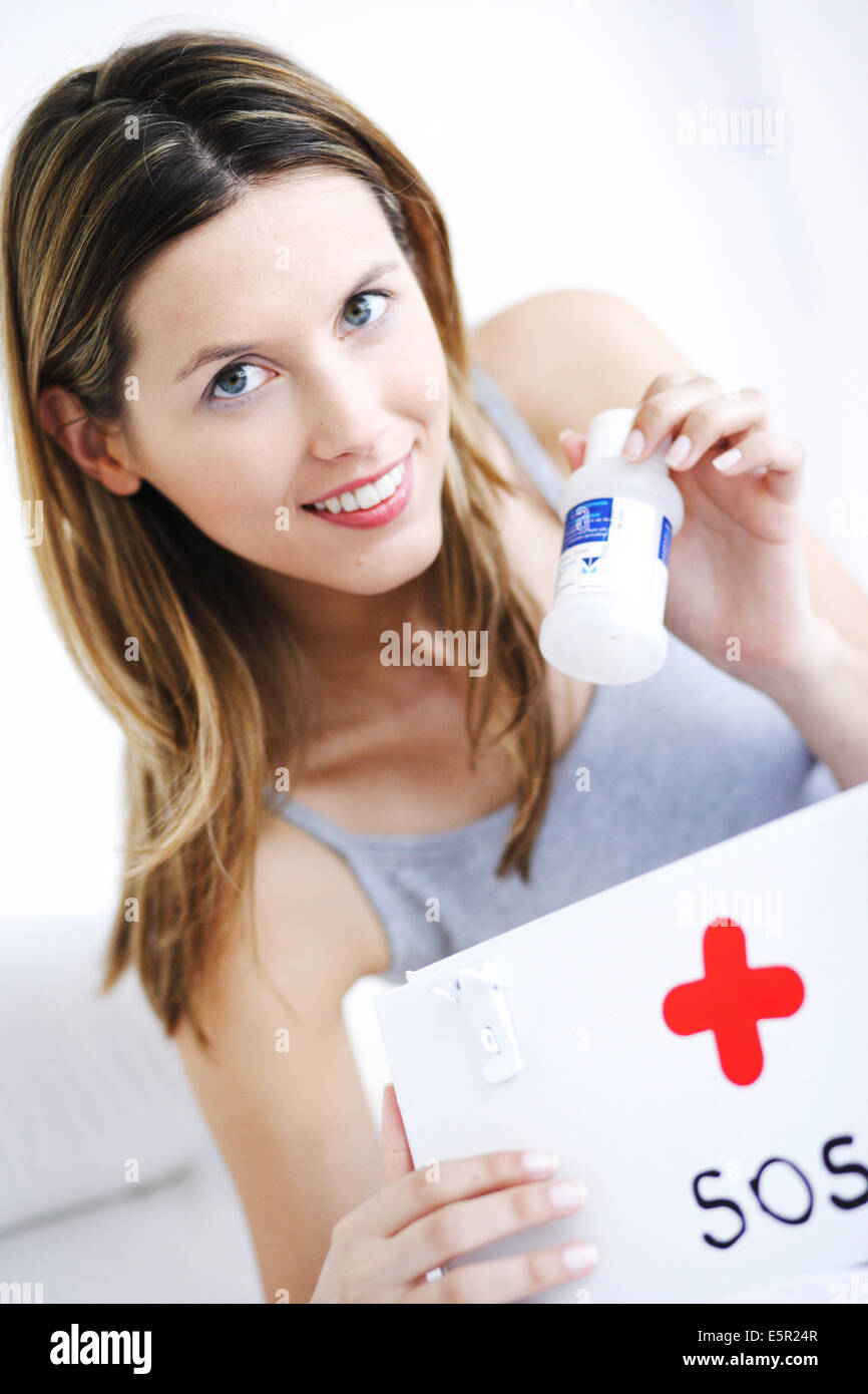 Woman first aid cabinet hi-res stock photography and images - Alamy