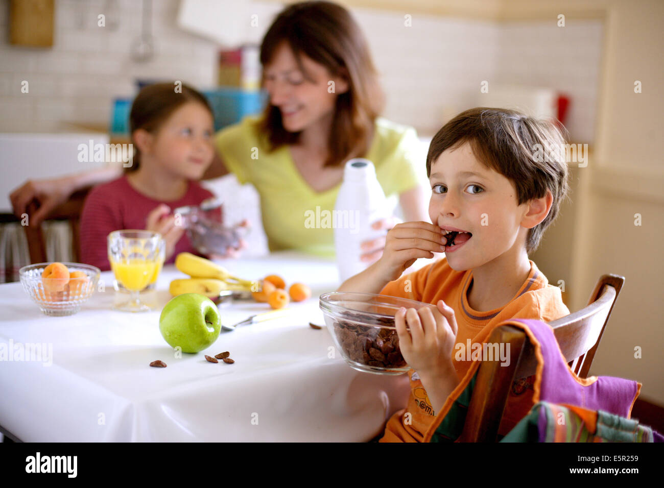 Children having breakfast Stock Photo - Alamy