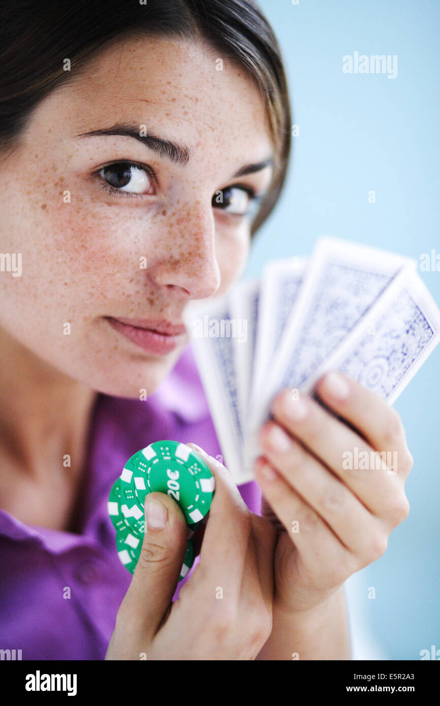 Woman playing poker Stock Photo - Alamy