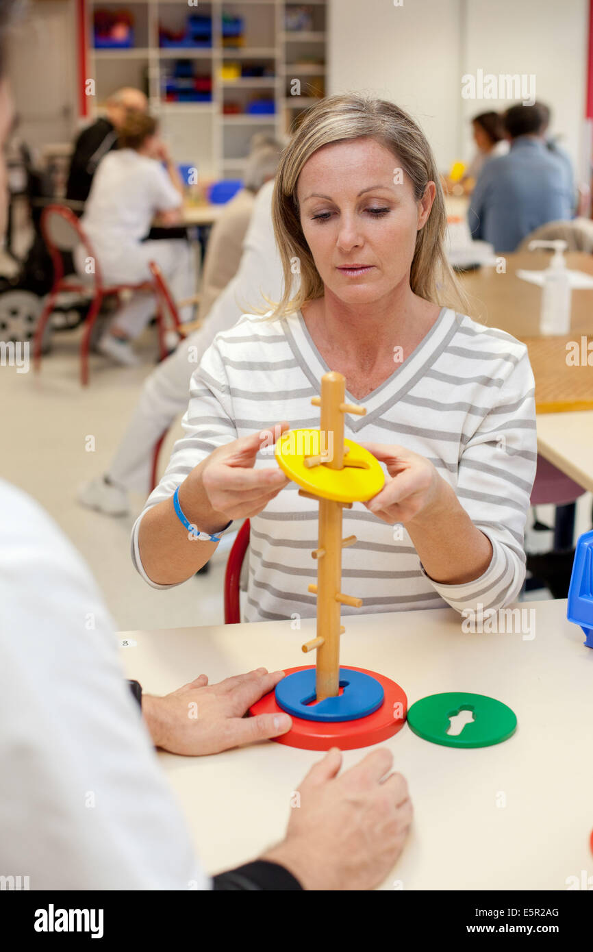 Functional rehabilitation of paralyzed on one side woman (model ...