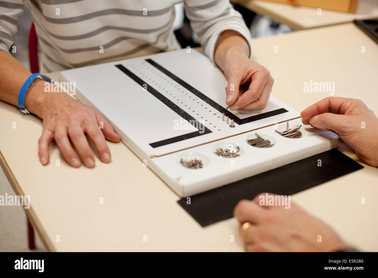 Functional rehabilitation of paralyzed on one side woman (model ...