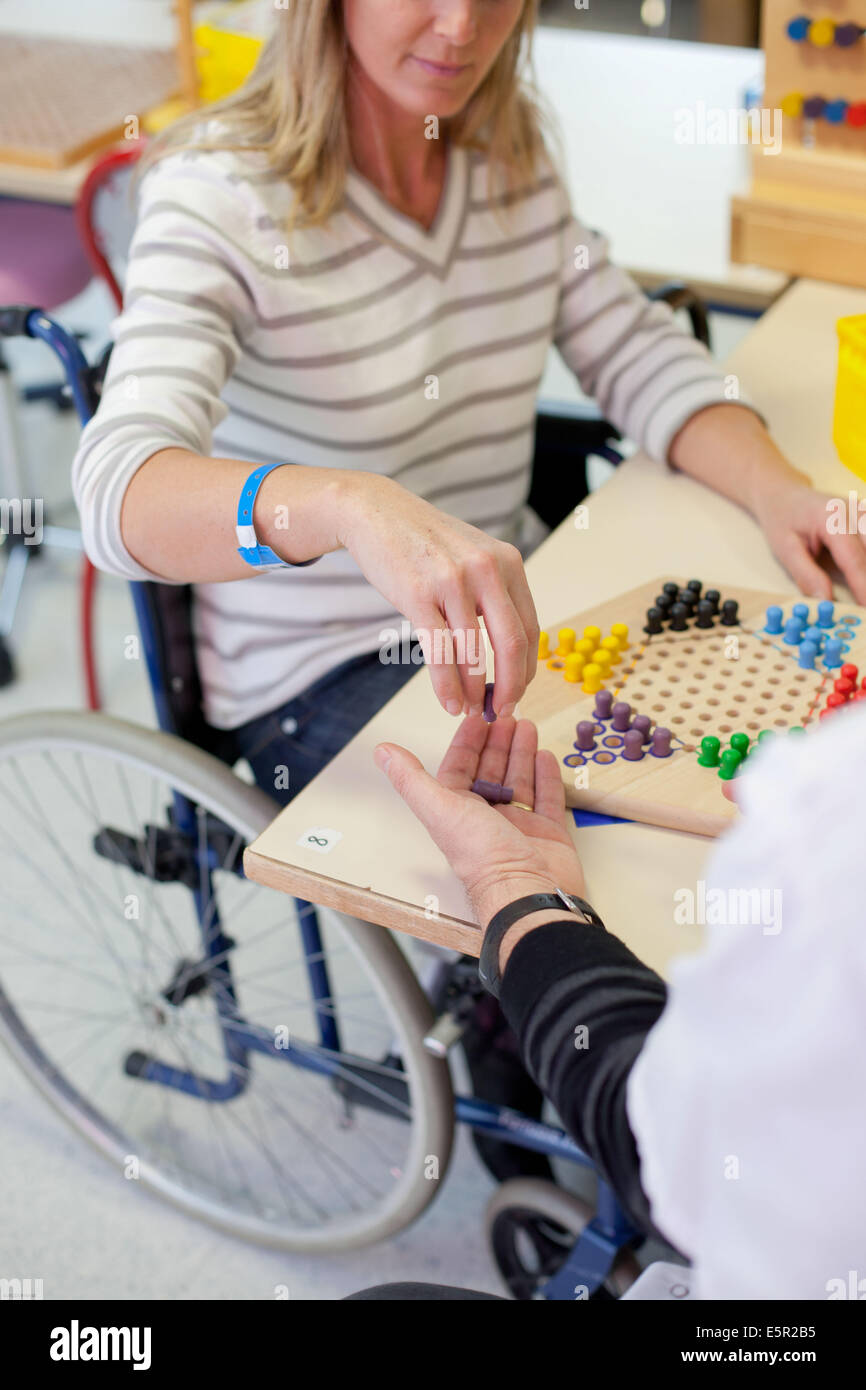 Functional rehabilitation of paralyzed on one side woman (model ...