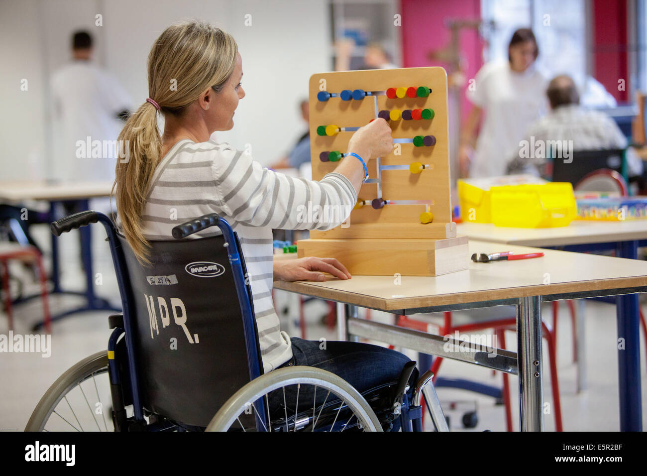 Functional rehabilitation of paralyzed on one side woman (model ...