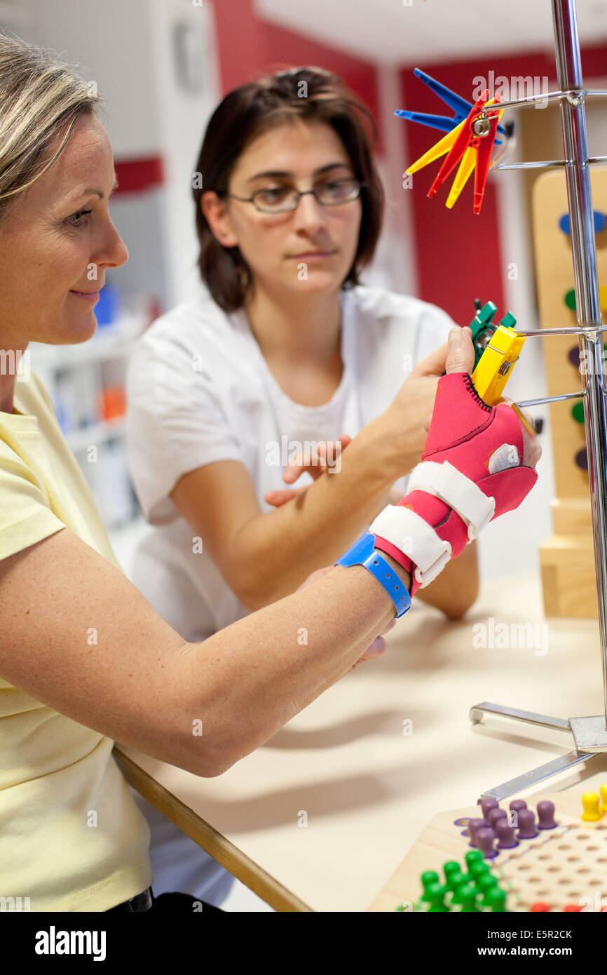 Functional rehabilitation of paralyzed on one side woman (model ...