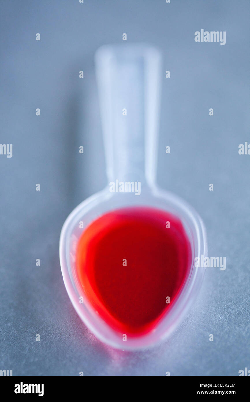 Cough syrup measuring spoon hi-res stock photography and images - Alamy