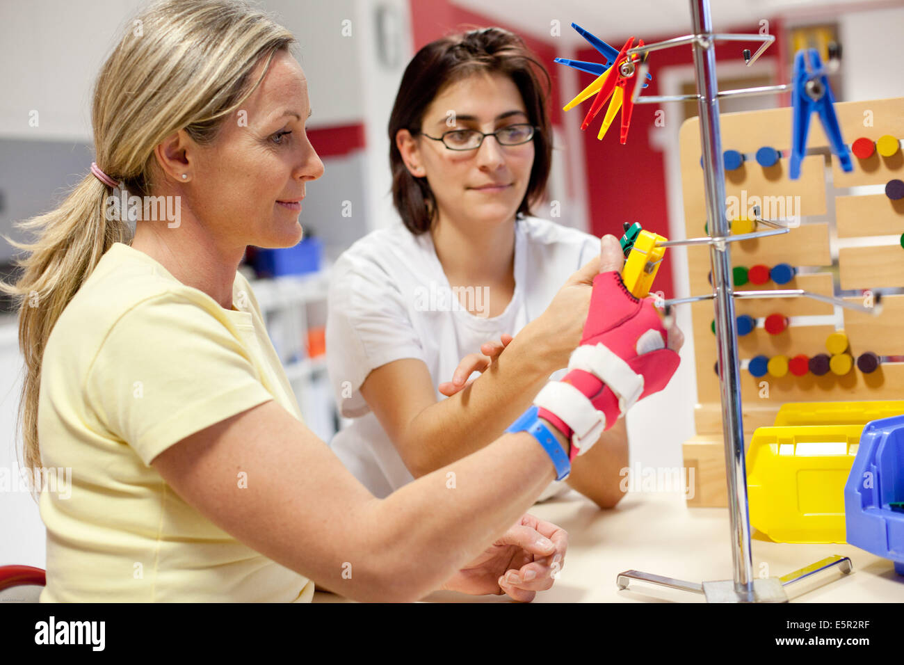 Functional rehabilitation of paralyzed on one side woman (model ...