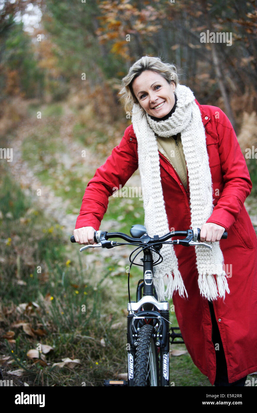 Woman riding a bike Stock Photo - Alamy