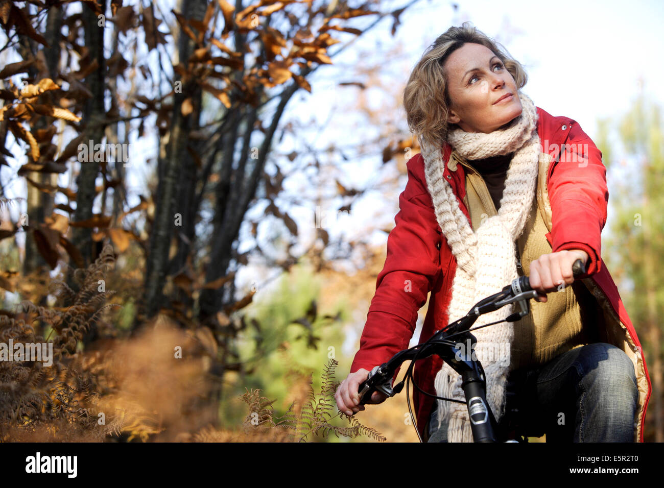 Woman riding a bike Stock Photo - Alamy