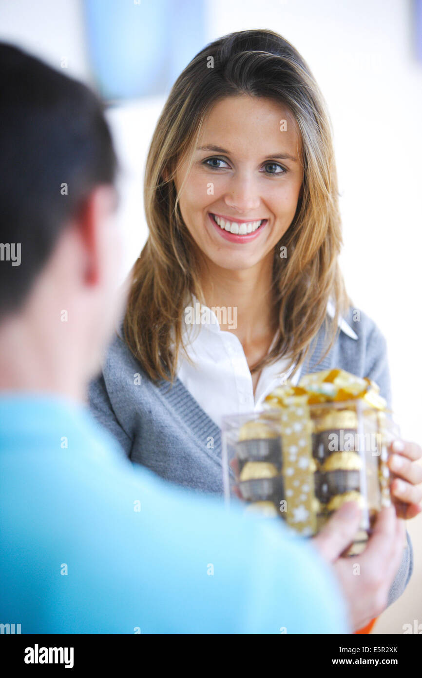 Woman receiving a chocolate box Stock Photo - Alamy
