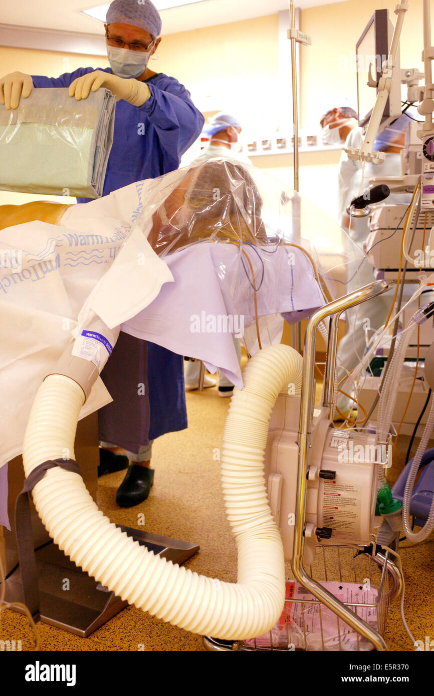Surgeon setting the operating field before performing surgery ...