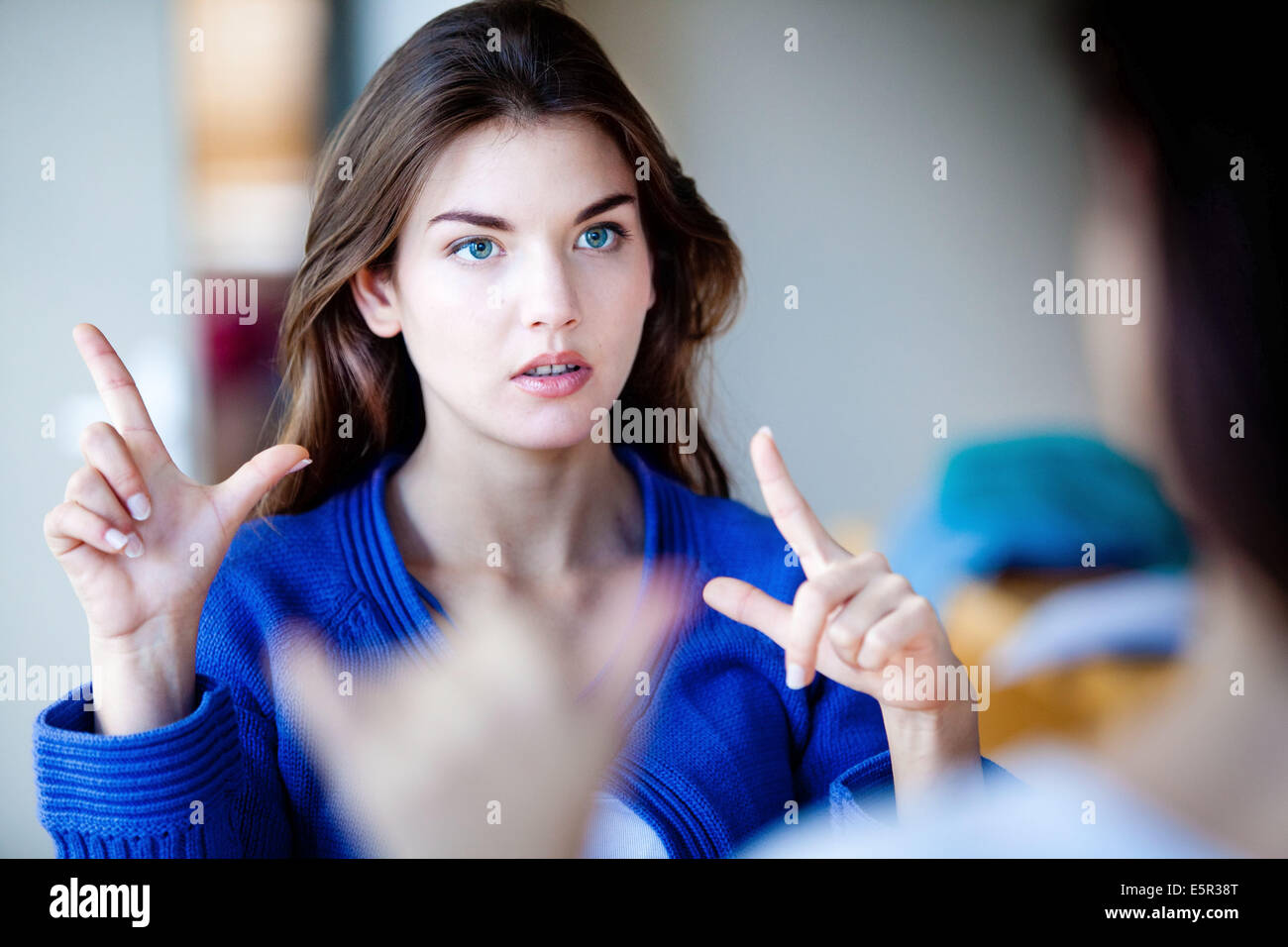 Woman communicating with sign language Stock Photo - Alamy