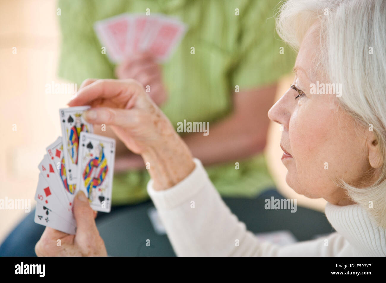 Grandparents grandchildren playing board hi-res stock photography and ...