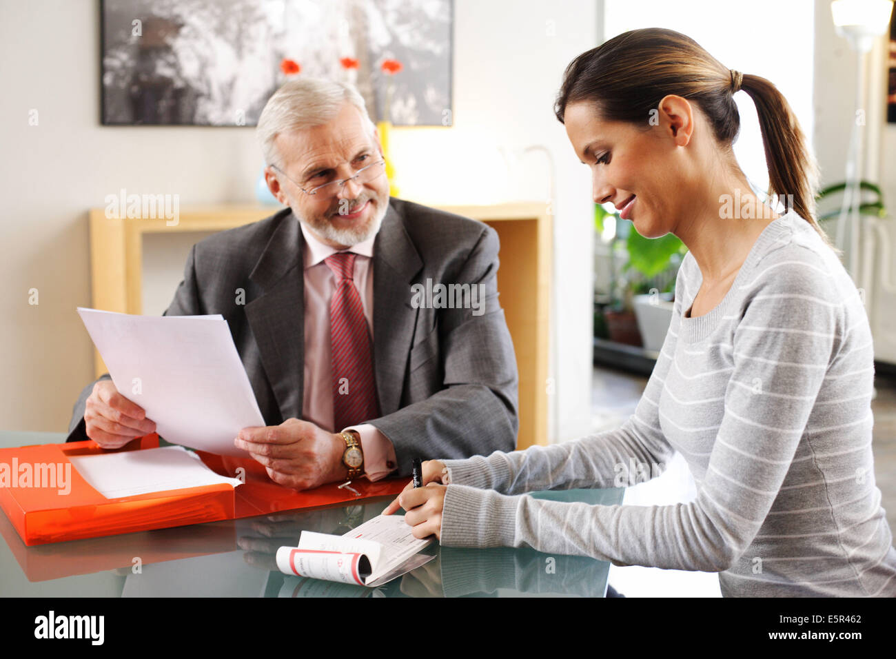 Paying in cheque hi-res stock photography and images - Alamy