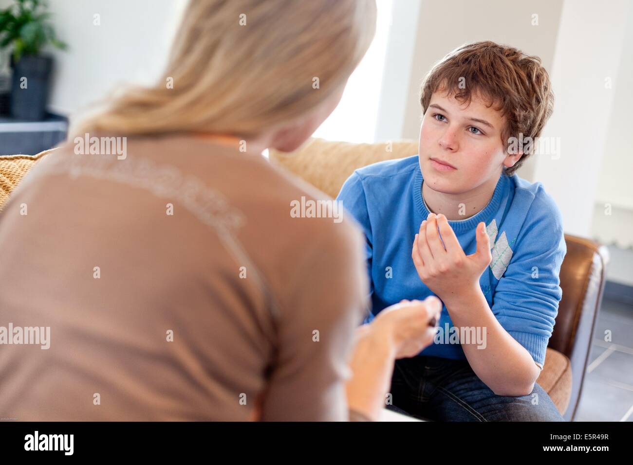 Mother and son having a discussion Stock Photo - Alamy