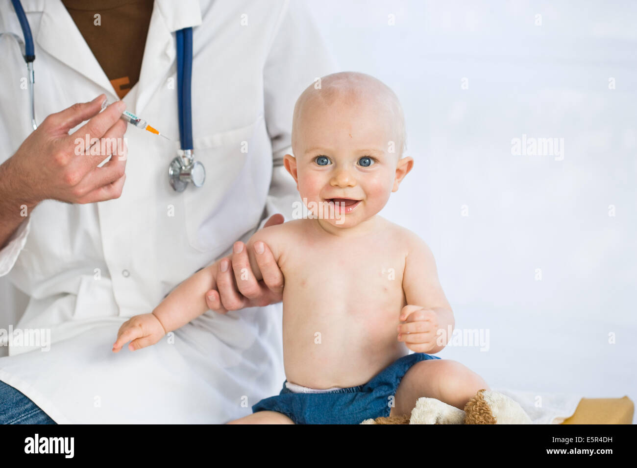 9 month old baby receiving vaccination Stock Photo - Alamy