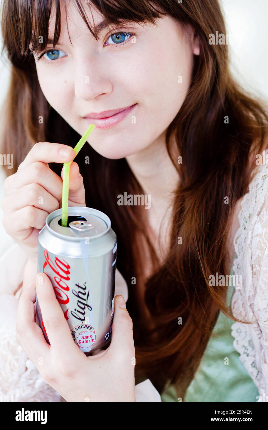 Woman drinking light soda Stock Photo - Alamy