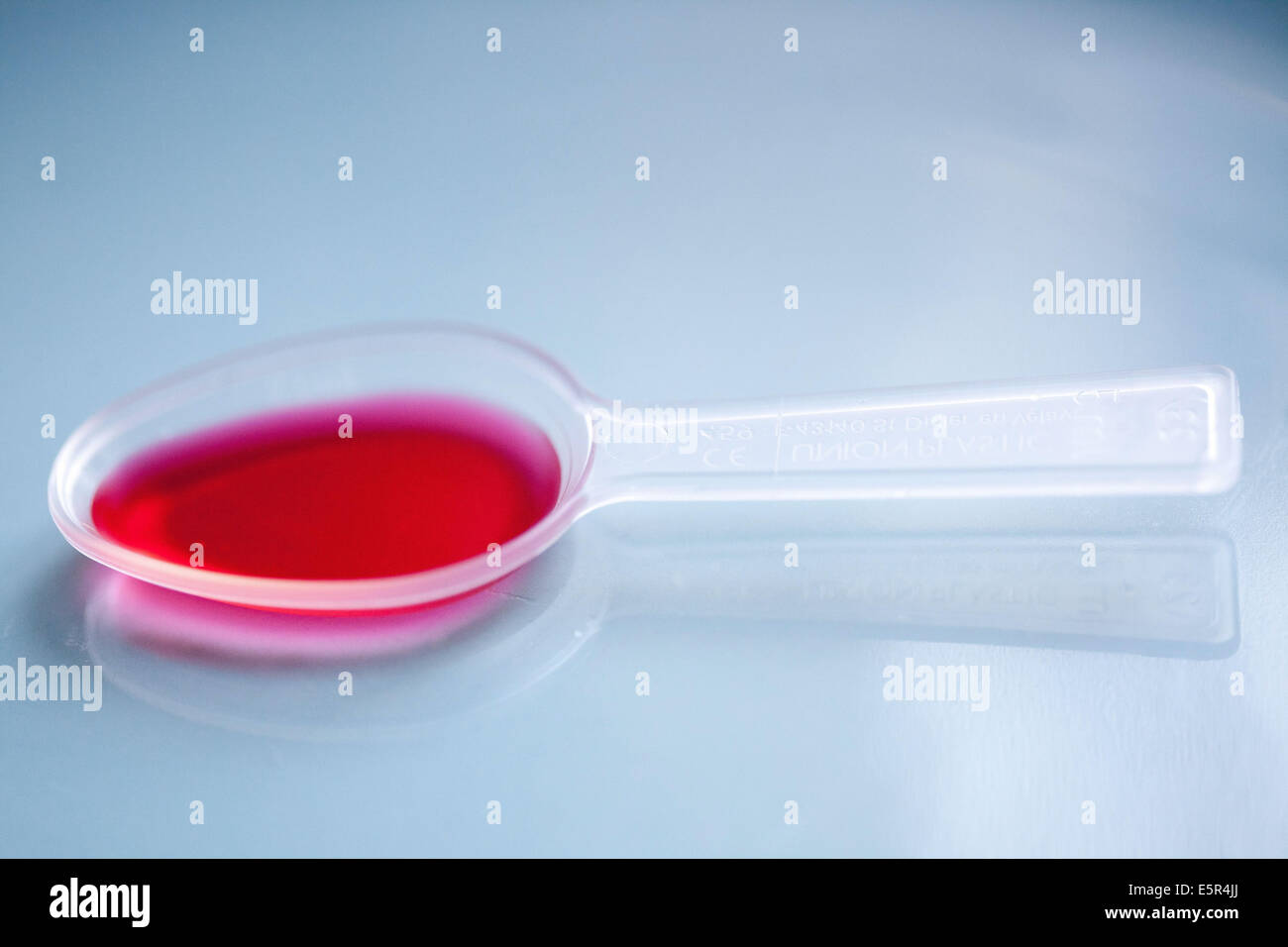 Spoonful of syrup Stock Photo - Alamy