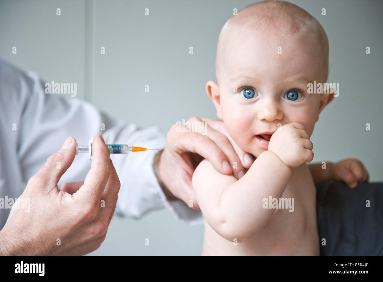 9 month old baby receiving vaccination Stock Photo - Alamy