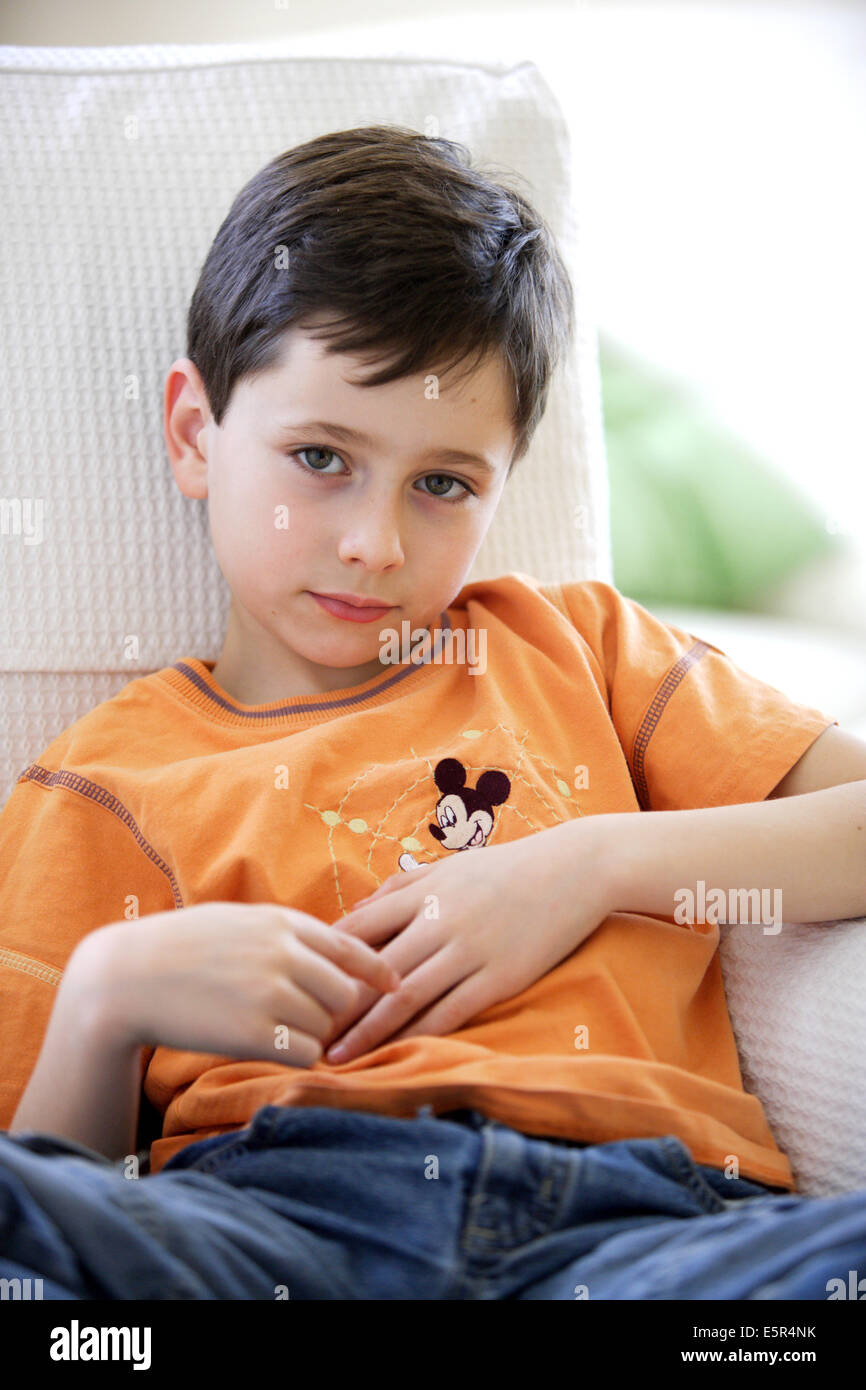8 year old child suffering from bellyache Stock Photo - Alamy