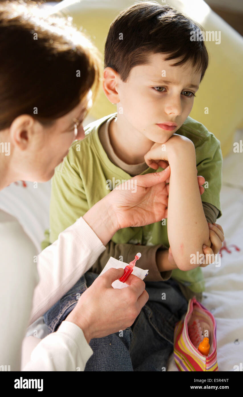 8 year old child with minor wound on elbow Stock Photo - Alamy