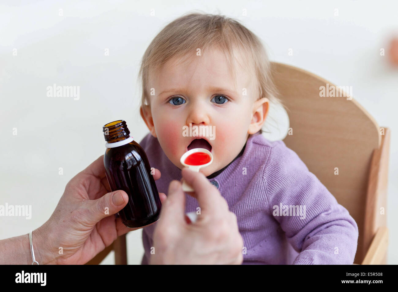 13-month-old taking syrop Stock Photo - Alamy