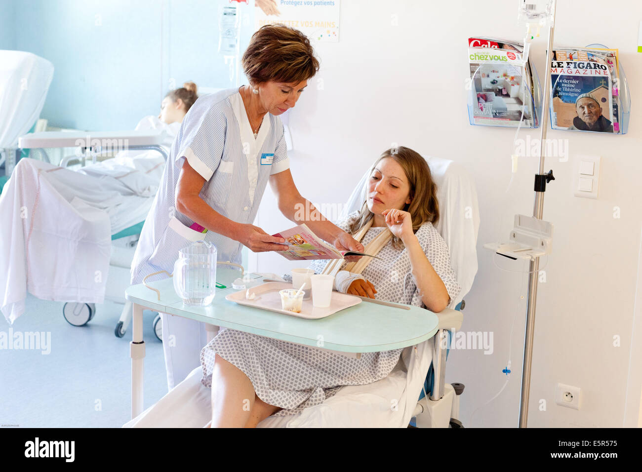 Nurse and female patient after carpal tunnel surgery, Day care surgery ...