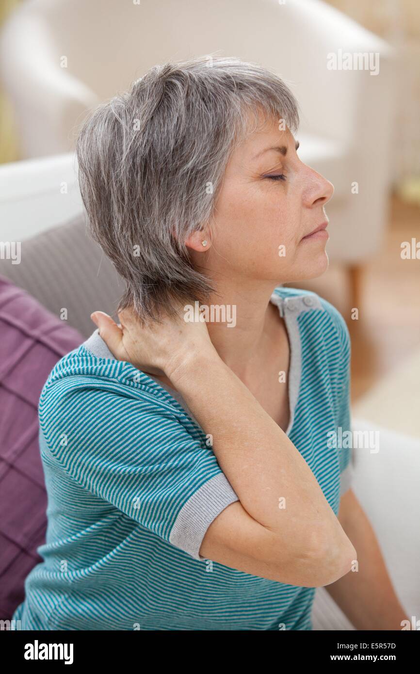 Woman suffering from neck pain Stock Photo - Alamy