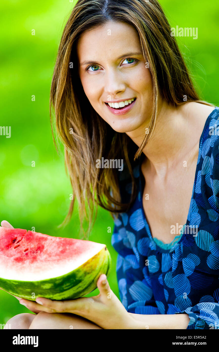 Woman eating watermelon Stock Photo - Alamy