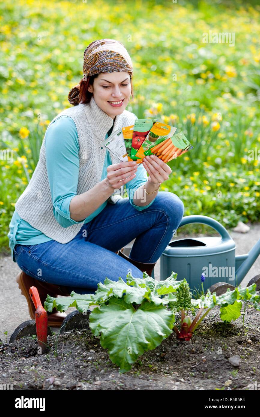 Woman gardening in her vegetable garden Stock Photo - Alamy