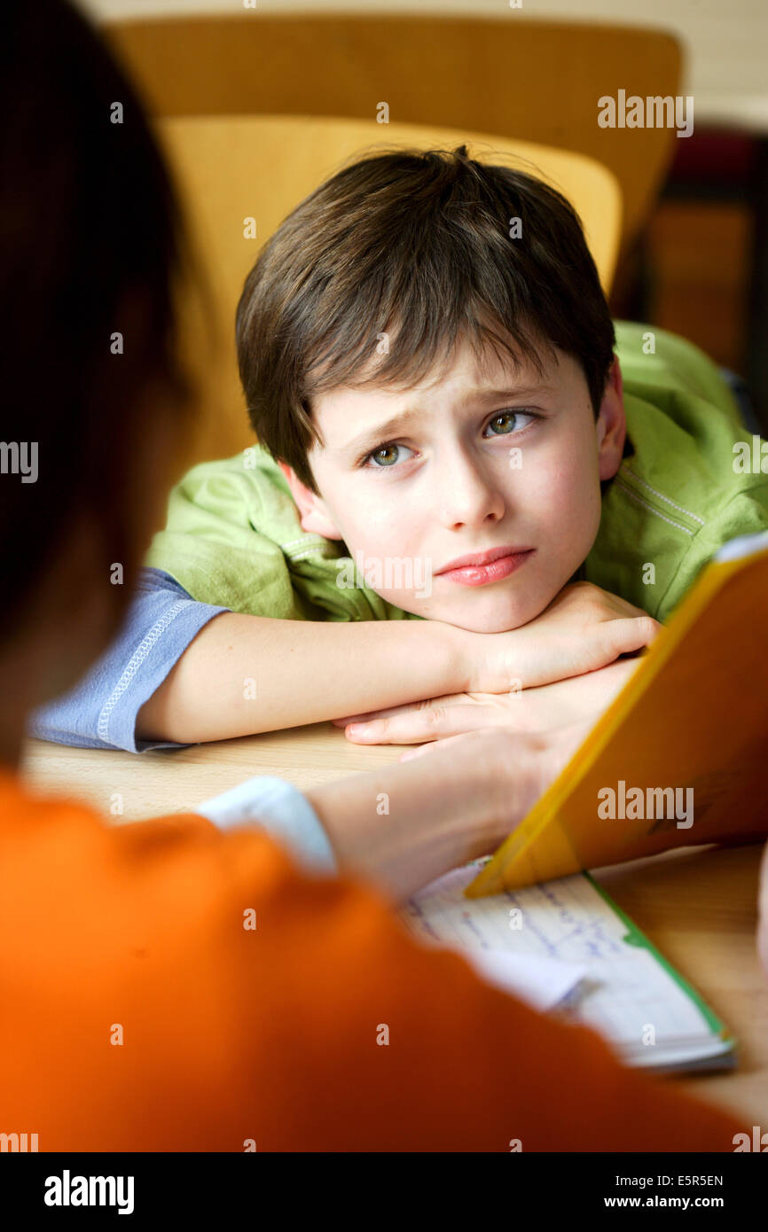 8 year old boy working Stock Photo - Alamy