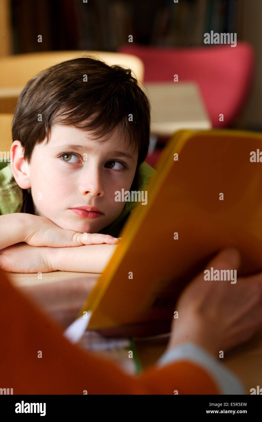 8 year old boy working Stock Photo - Alamy