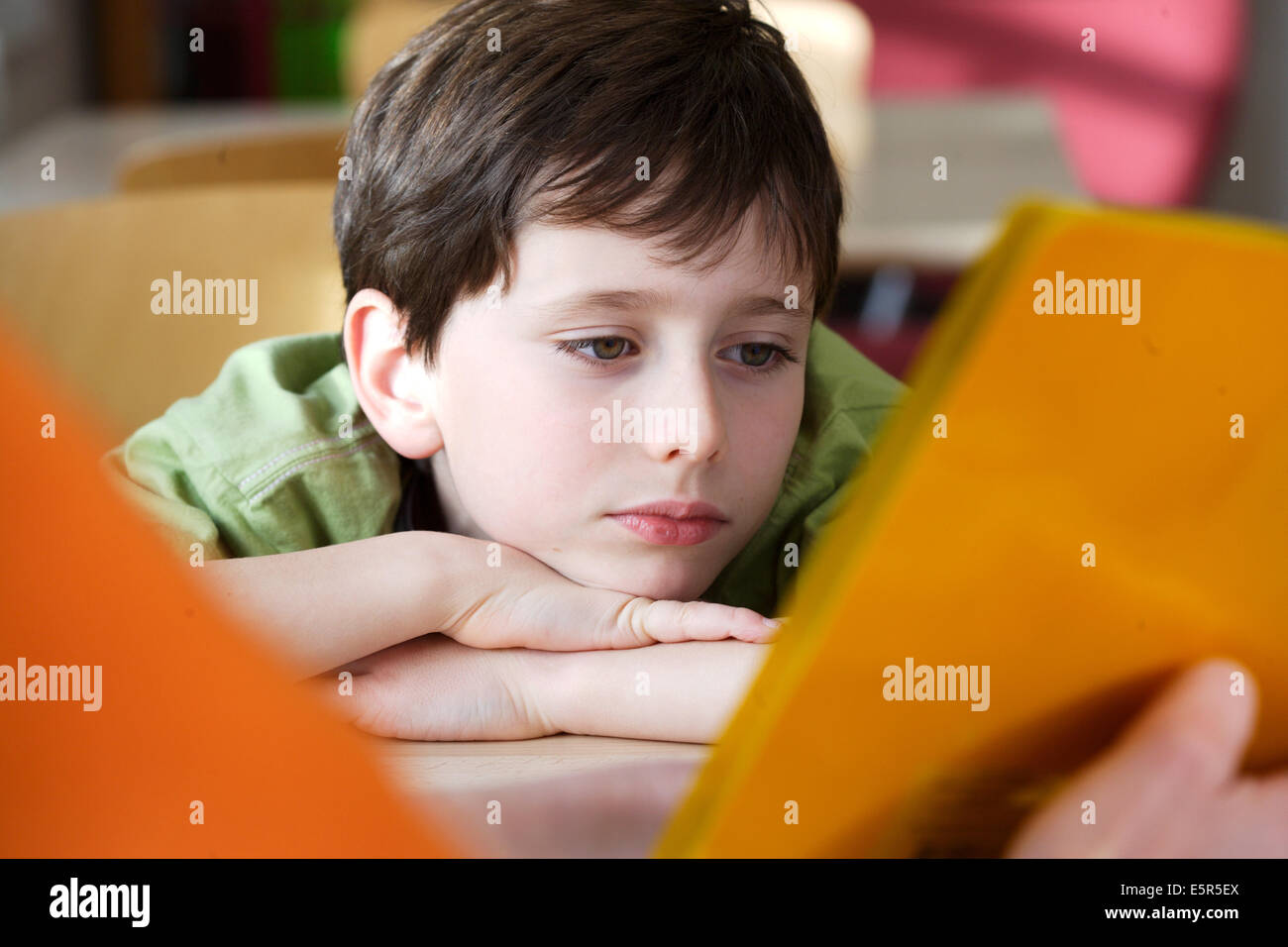 8 year old boy working Stock Photo - Alamy