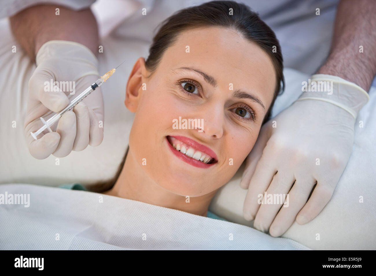 Woman receiving Botox injections for treatment of wrinkles Stock Photo ...