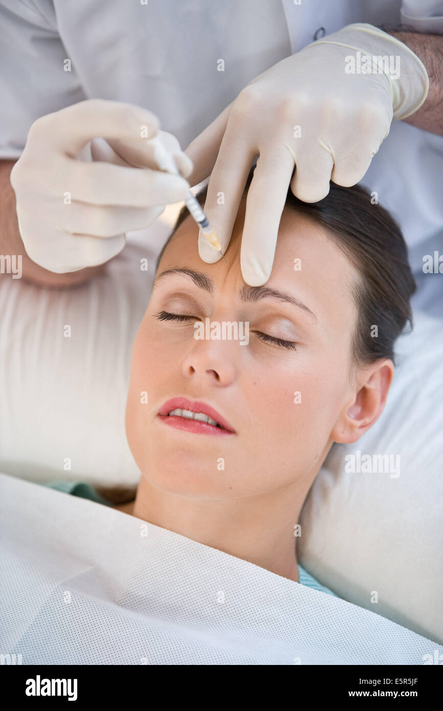 Woman receiving Botox injections for treatment of lion's wrinkles Stock ...