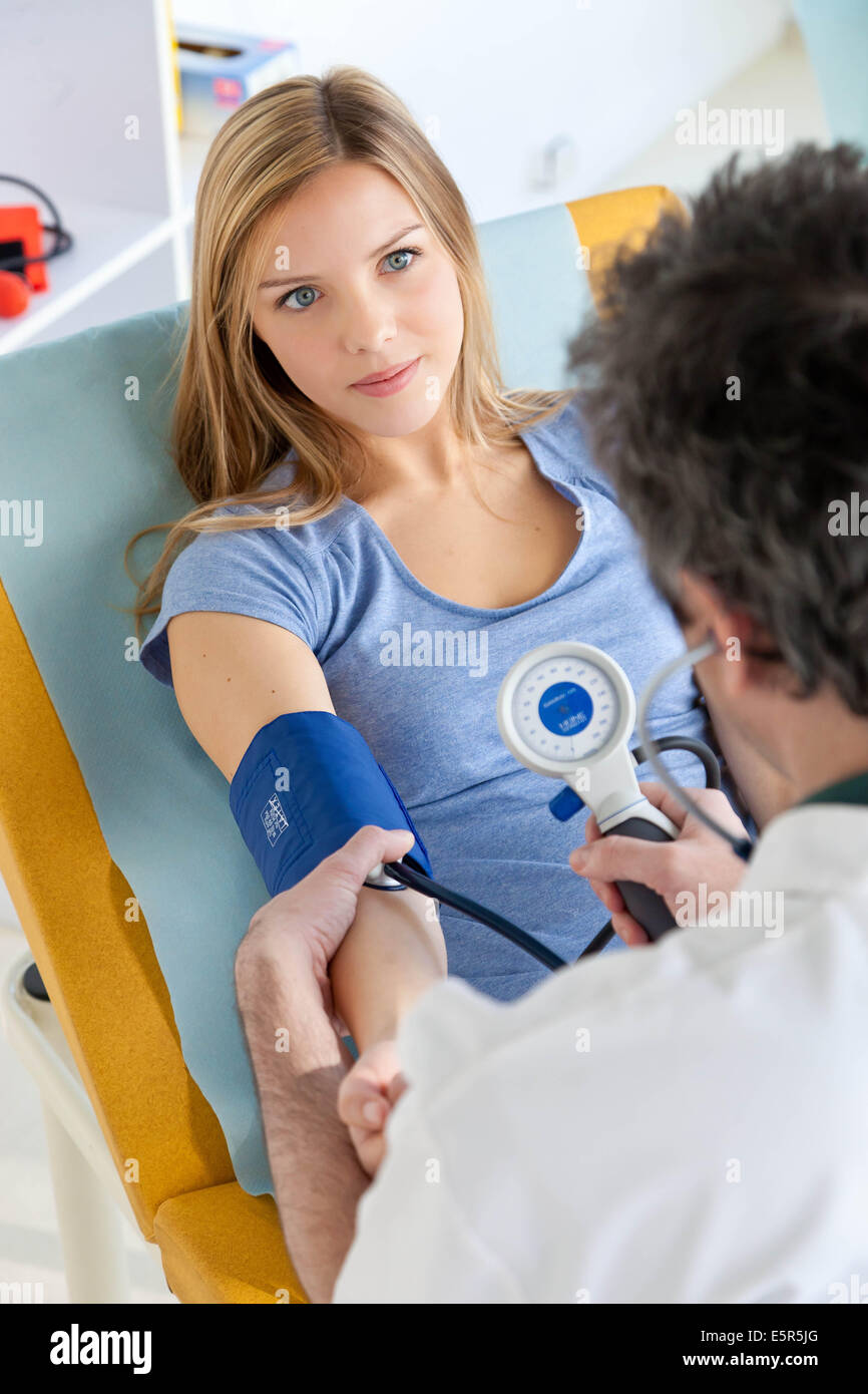 Checking blood pressure Stock Photo - Alamy