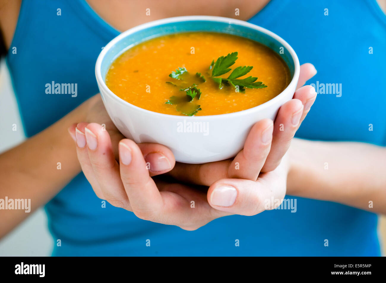 Woman eating a soup Stock Photo - Alamy