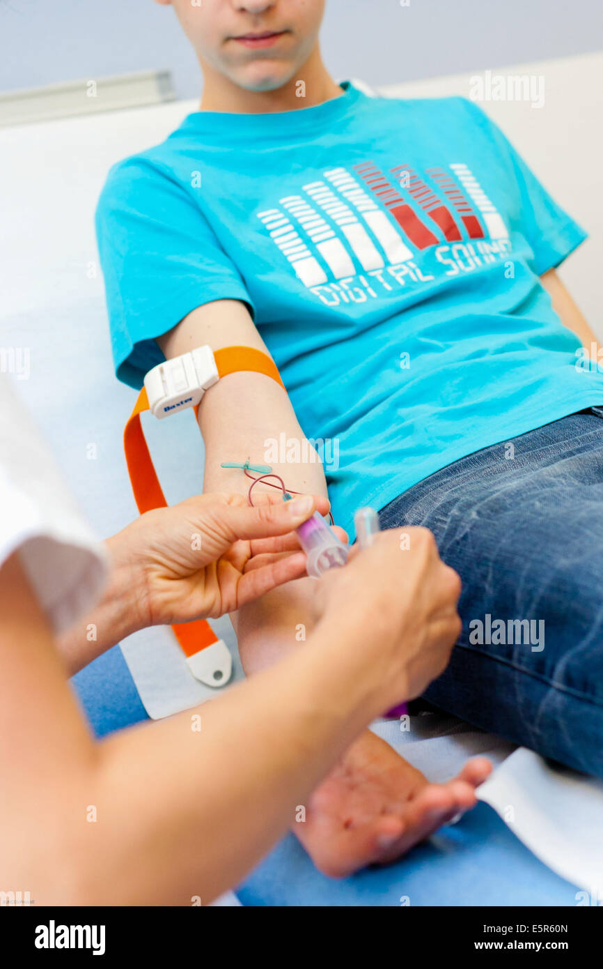 Nurse taking teenager blood sample, Limoges hospital, France Stock ...