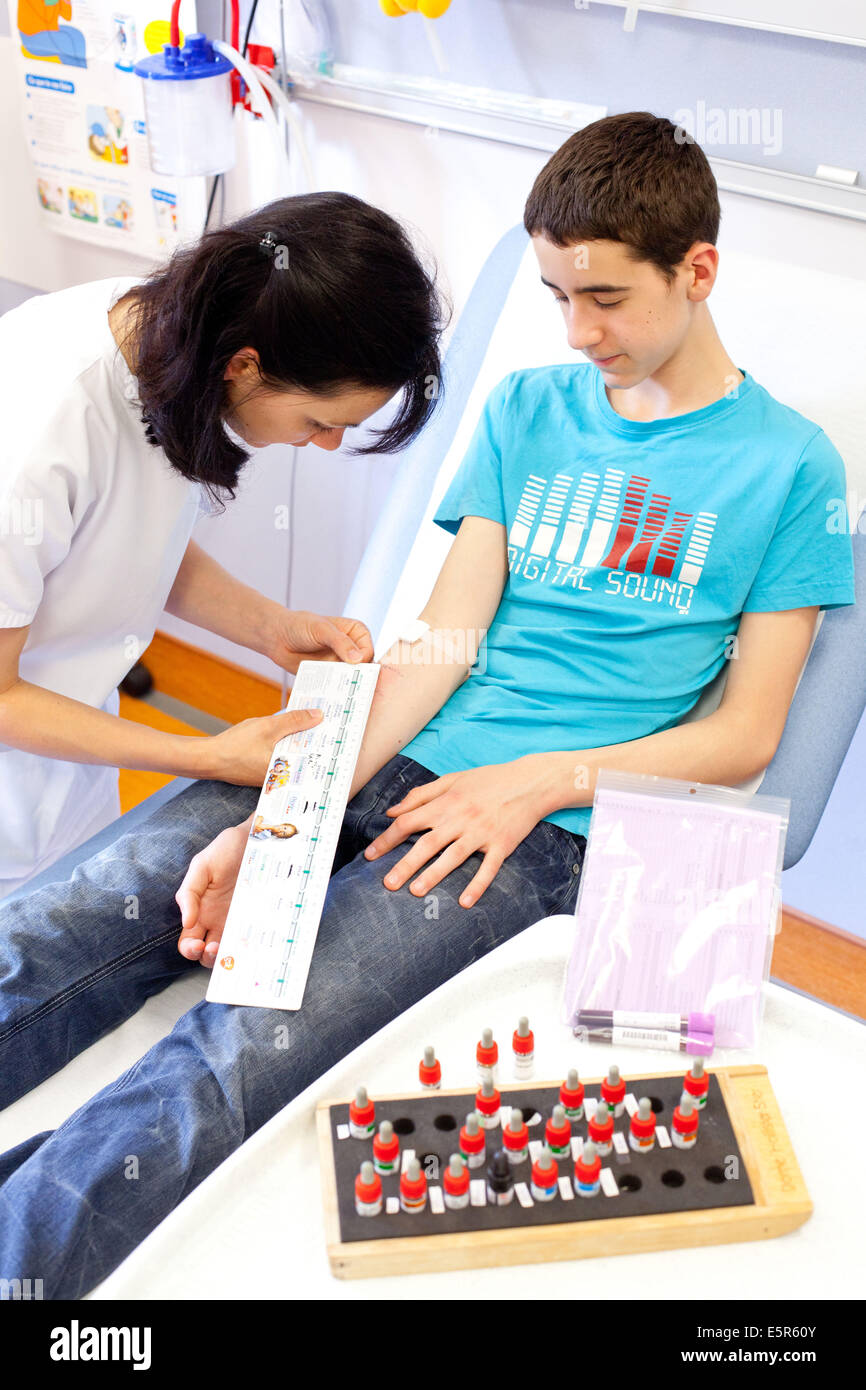 Child undergoing skin prick test for allergens screening, Limoges ...