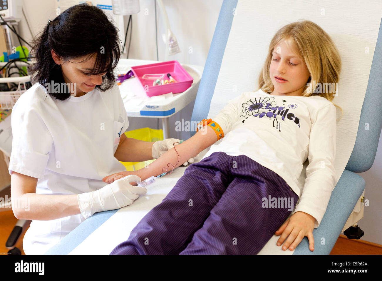 Nurse taking 8 years old girl's blood sample, Limoges hospital, France ...