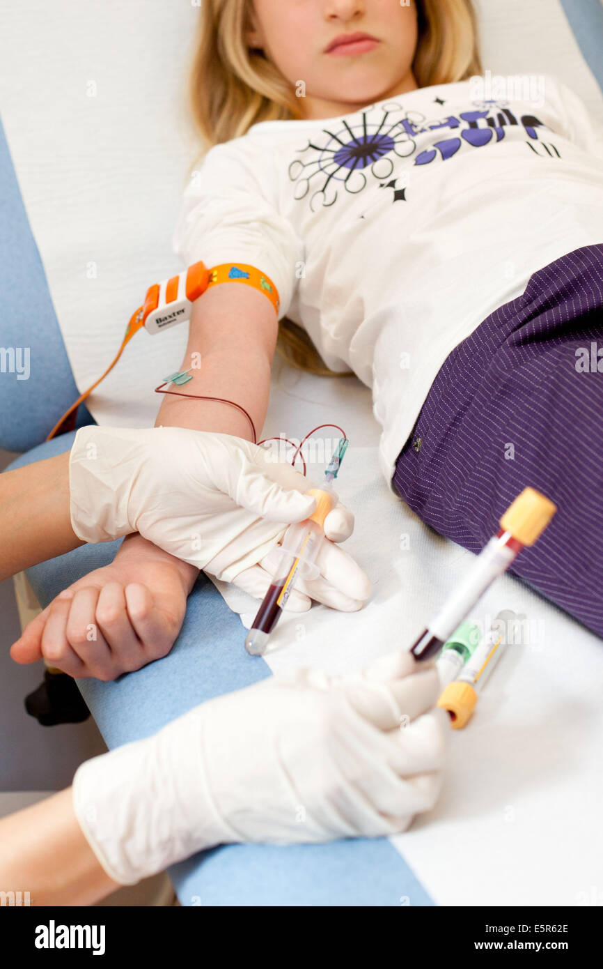 Nurse taking 8 years old girl's blood sample, Limoges hospital, France ...