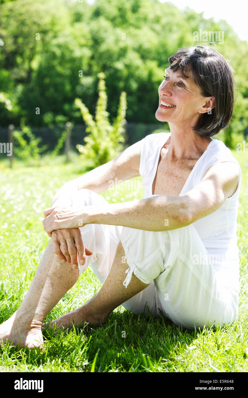 50 year old woman sitting hi-res stock photography and images - Alamy