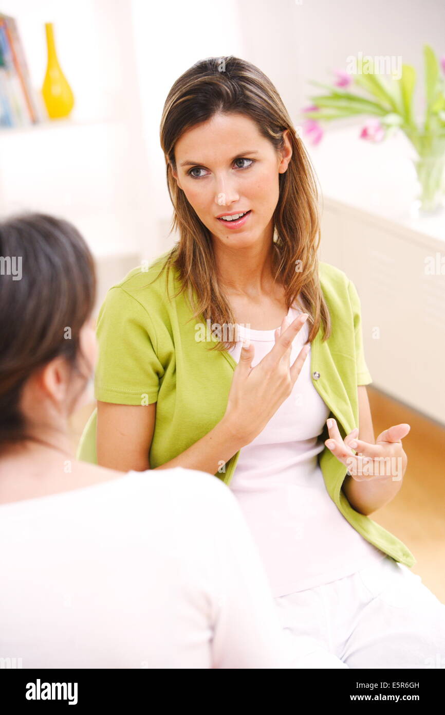 Two women having a conversation Stock Photo - Alamy