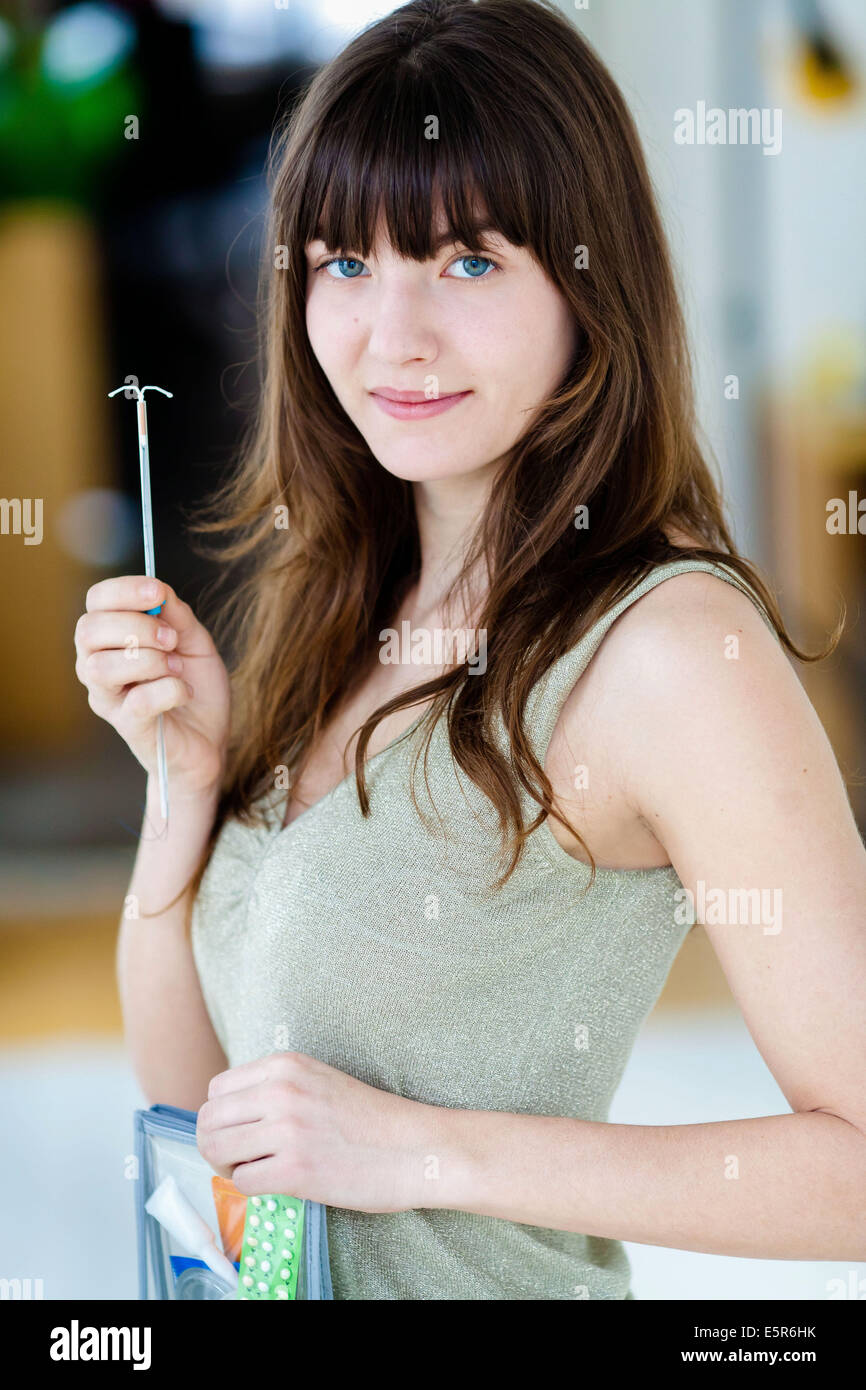 Woman holding intra-Uterine contraceptive Device Stock Photo - Alamy