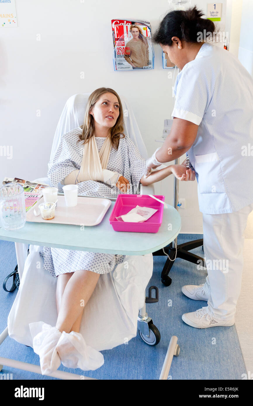 Nurse and female patient after carpal tunnel surgery, Day care surgery ...