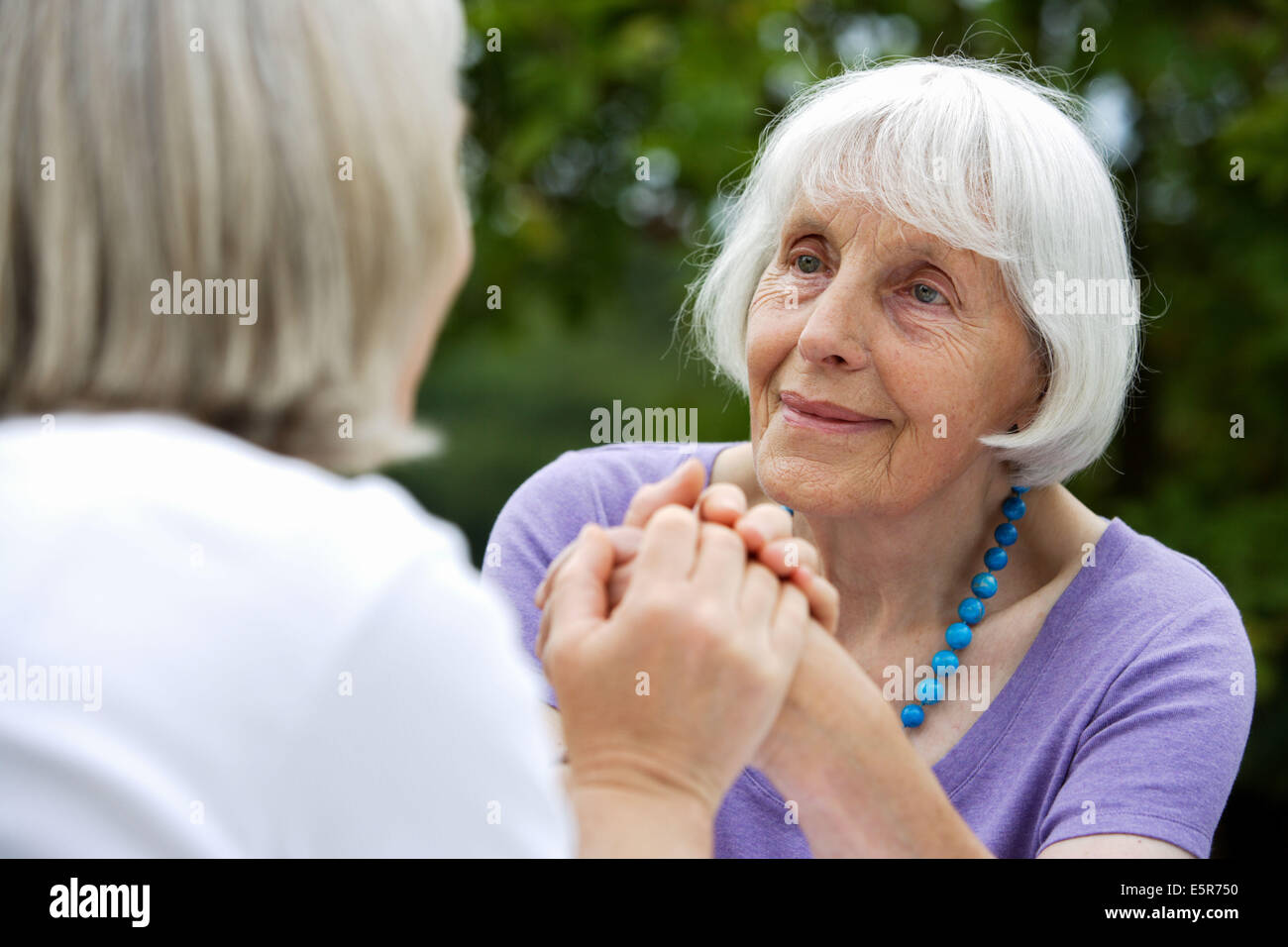 80 year old woman talking with her daughter Stock Photo - Alamy